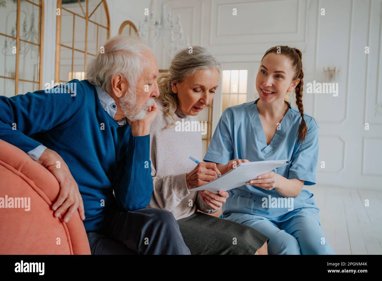 Senior woman signing document hi-res stock photography and images - Alamy