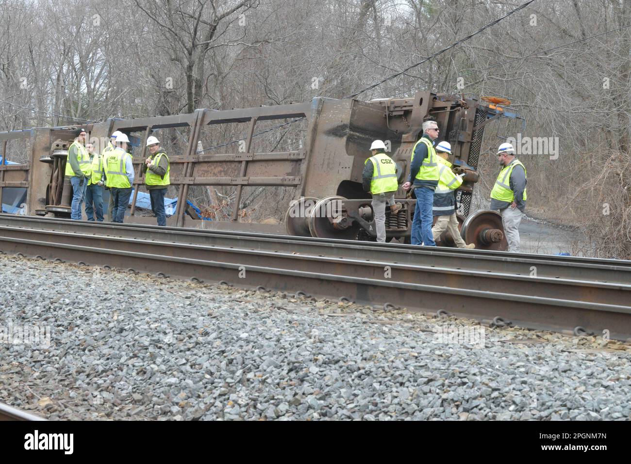 Ayer, Massachusetts, USA. 24th Mar, 2023. Derailed train cars litter the railbed at a derailment ...