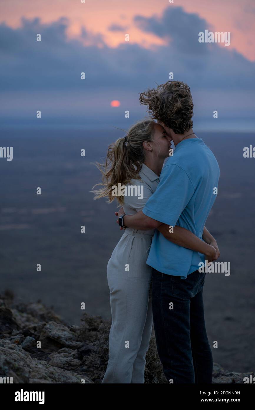 Romantic woman embracing boyfriend on hi-res stock photography and ...