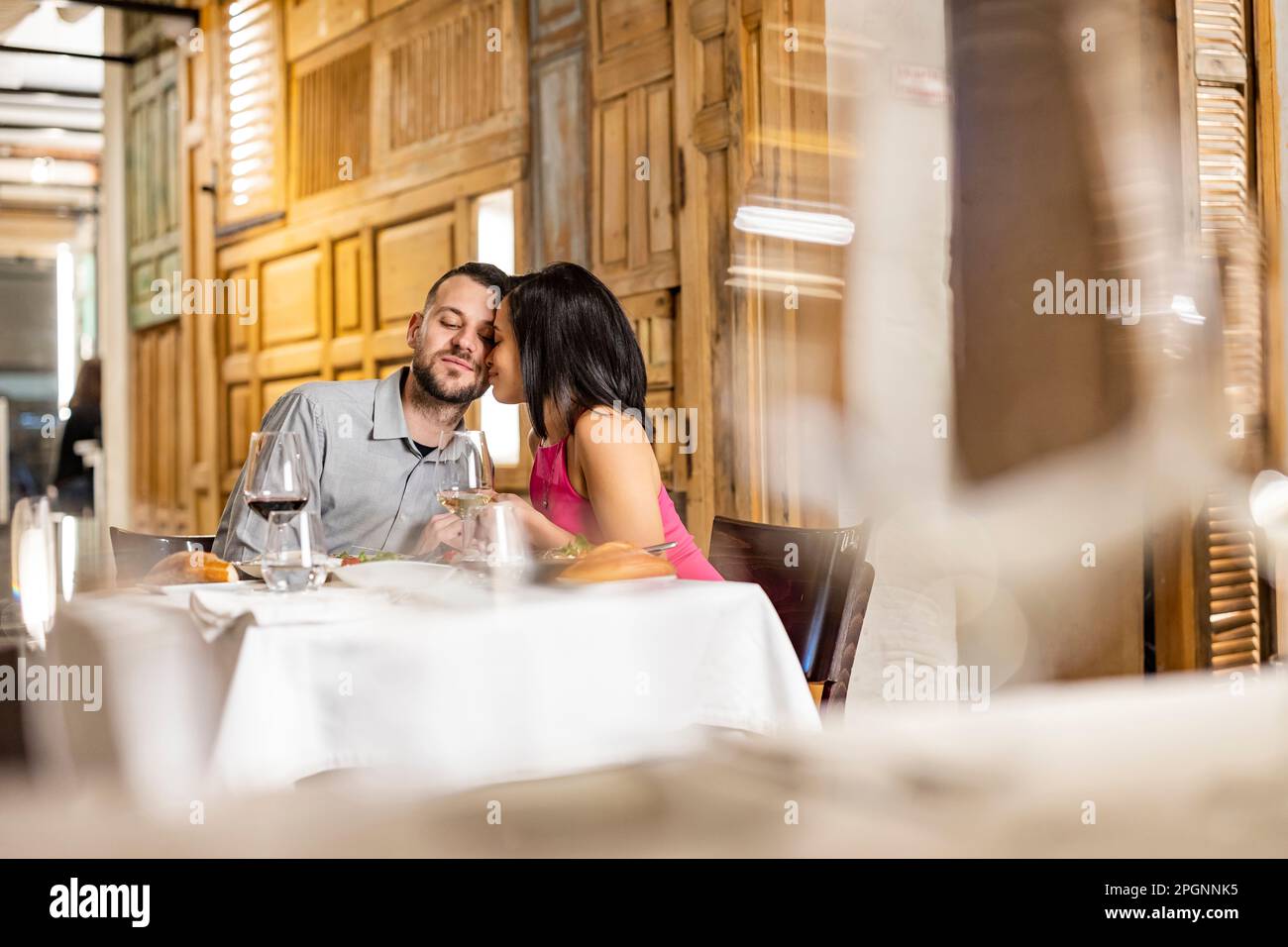 Affectionate couple touching forehead at restaurant Stock Photo - Alamy