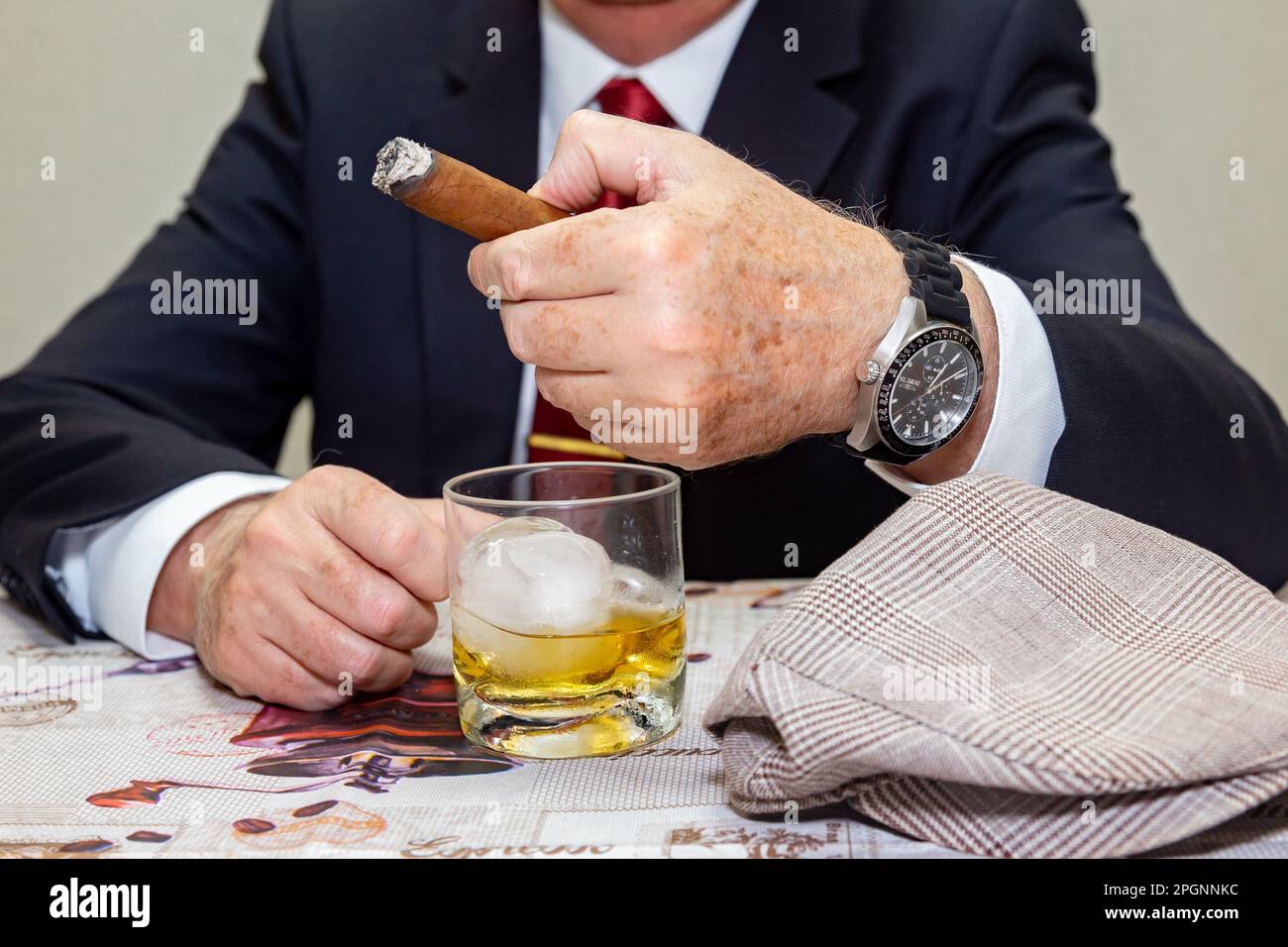 Caucasian elegant man in suit and tie with whiskey and cigar Stock ...