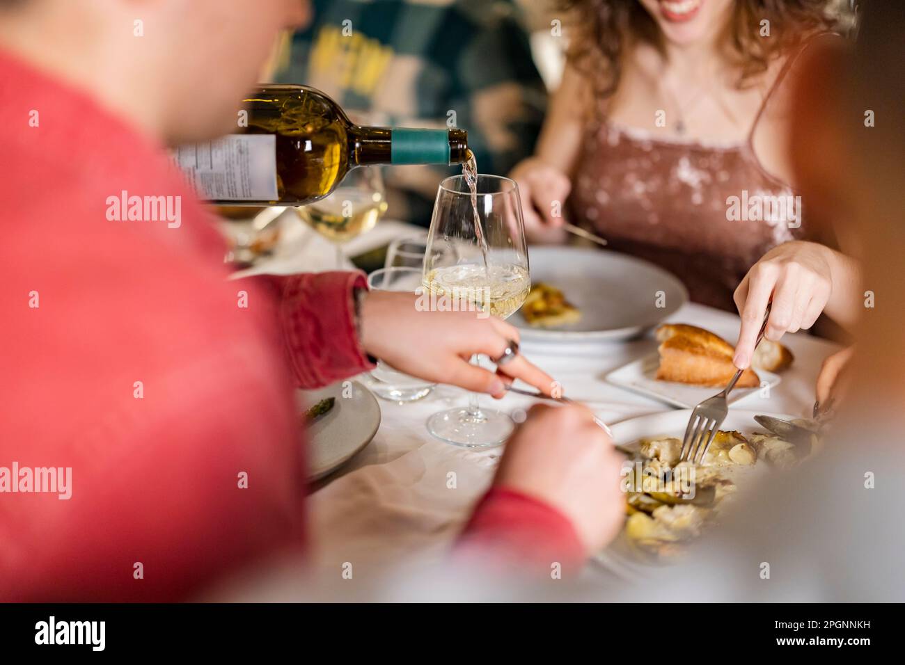 Friends having dinner at restaurant Stock Photo - Alamy