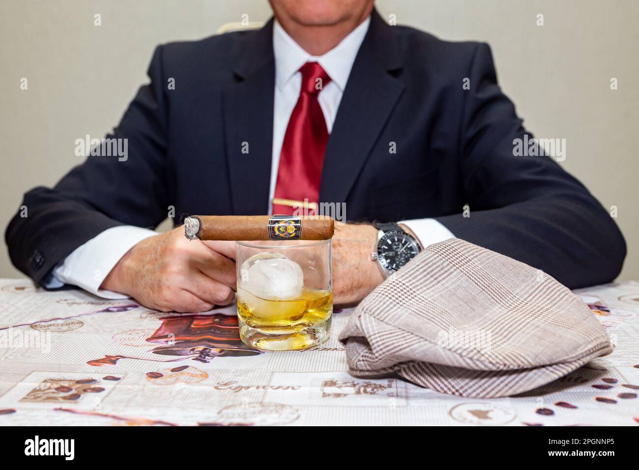 Caucasian elegant man in suit and tie with whiskey and cigar Stock ...