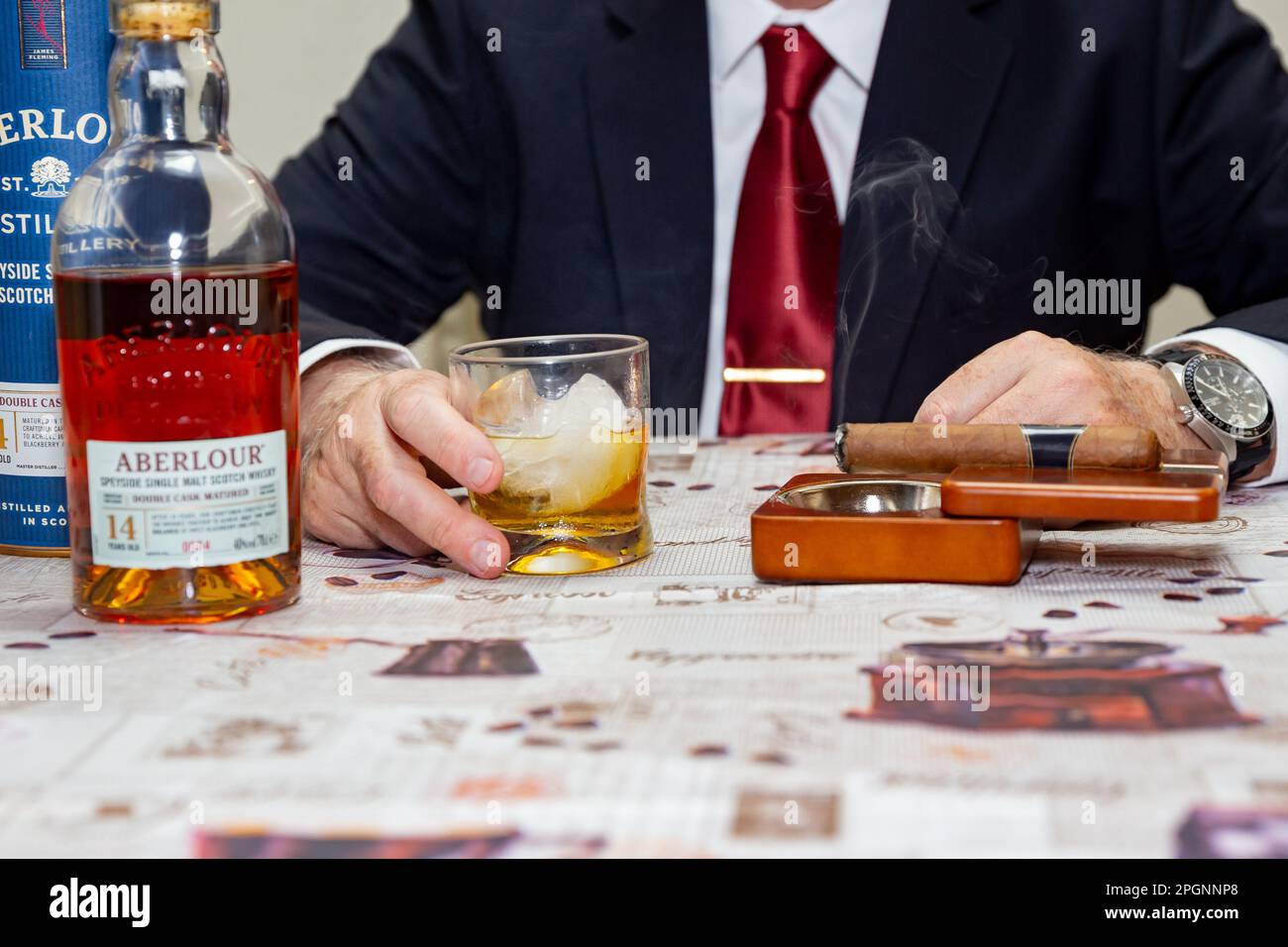 Caucasian elegant man in suit and tie with whiskey and cigar Stock ...