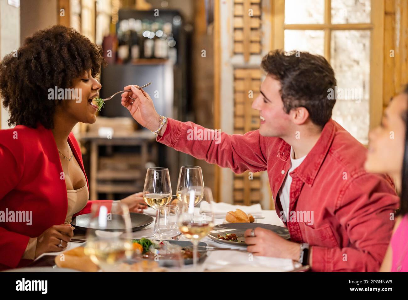 Group of young adults eating restaurant hi-res stock photography and ...