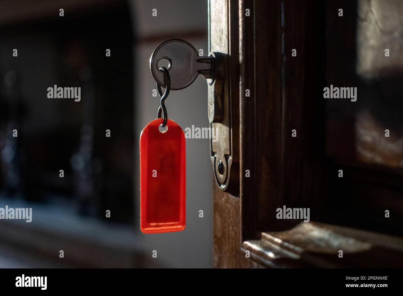 Key in lock of front door Stock Photo - Alamy