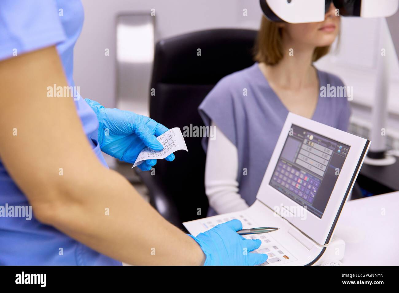 Ophthalmologist doing eye check up with patient at clinic Stock Photo ...