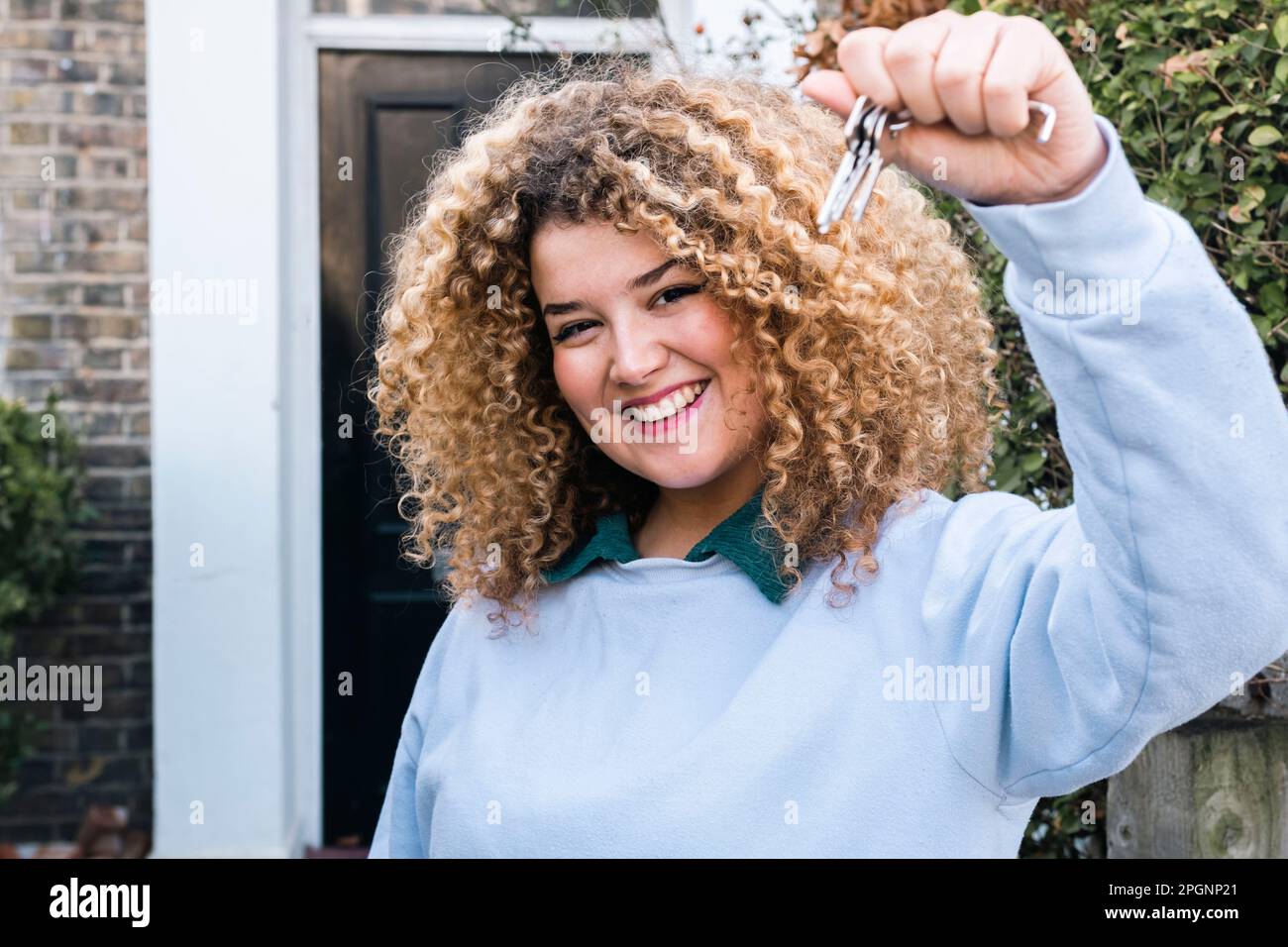 Woman curly hairstyle showing hi-res stock photography and images - Alamy
