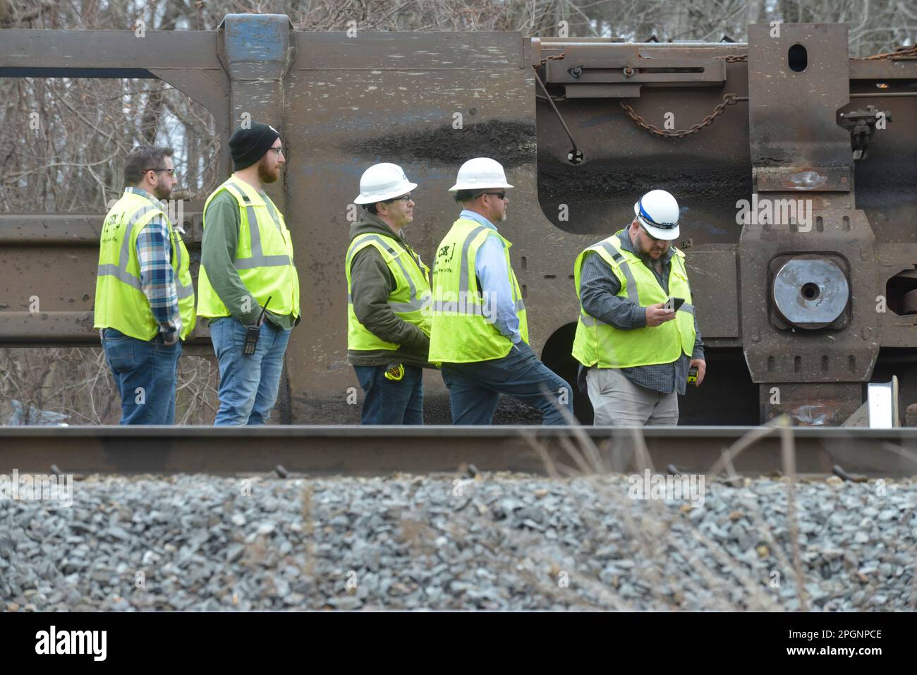 Ayer, Massachusetts, USA. 24th Mar, 2023. Derailed train cars litter the railbed at a derailment ...