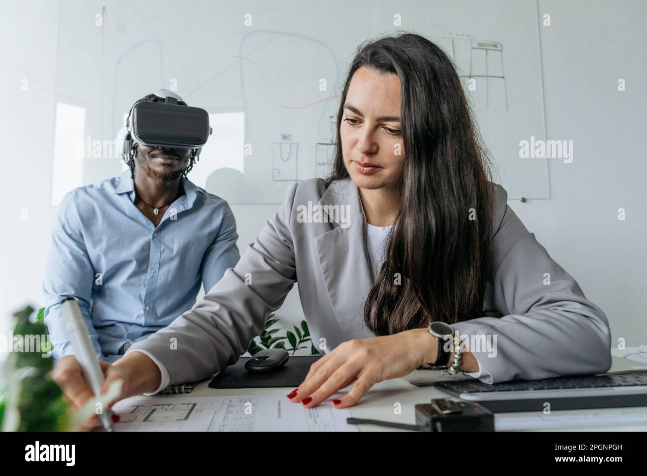 Female architect explaining virtual hi-res stock photography and images ...