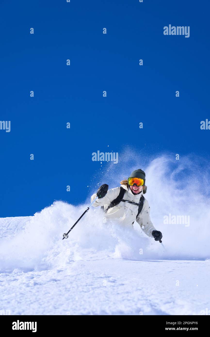 Woman skiing powder under hi-res stock photography and images - Alamy