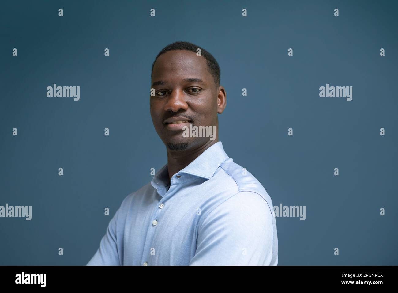 Portrait of adult against blue background hi-res stock photography and ...
