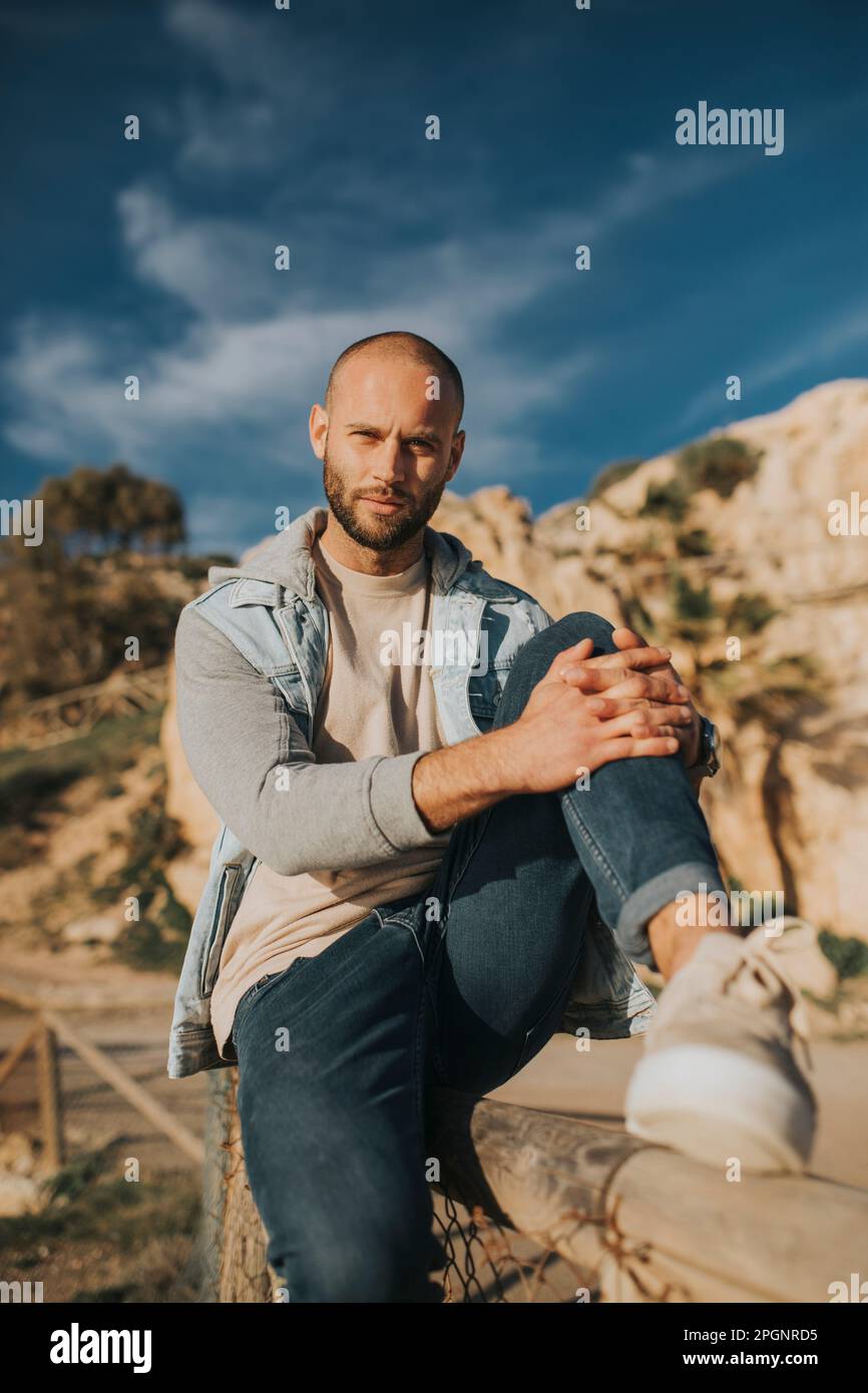 Man sitting fence hi-res stock photography and images - Alamy