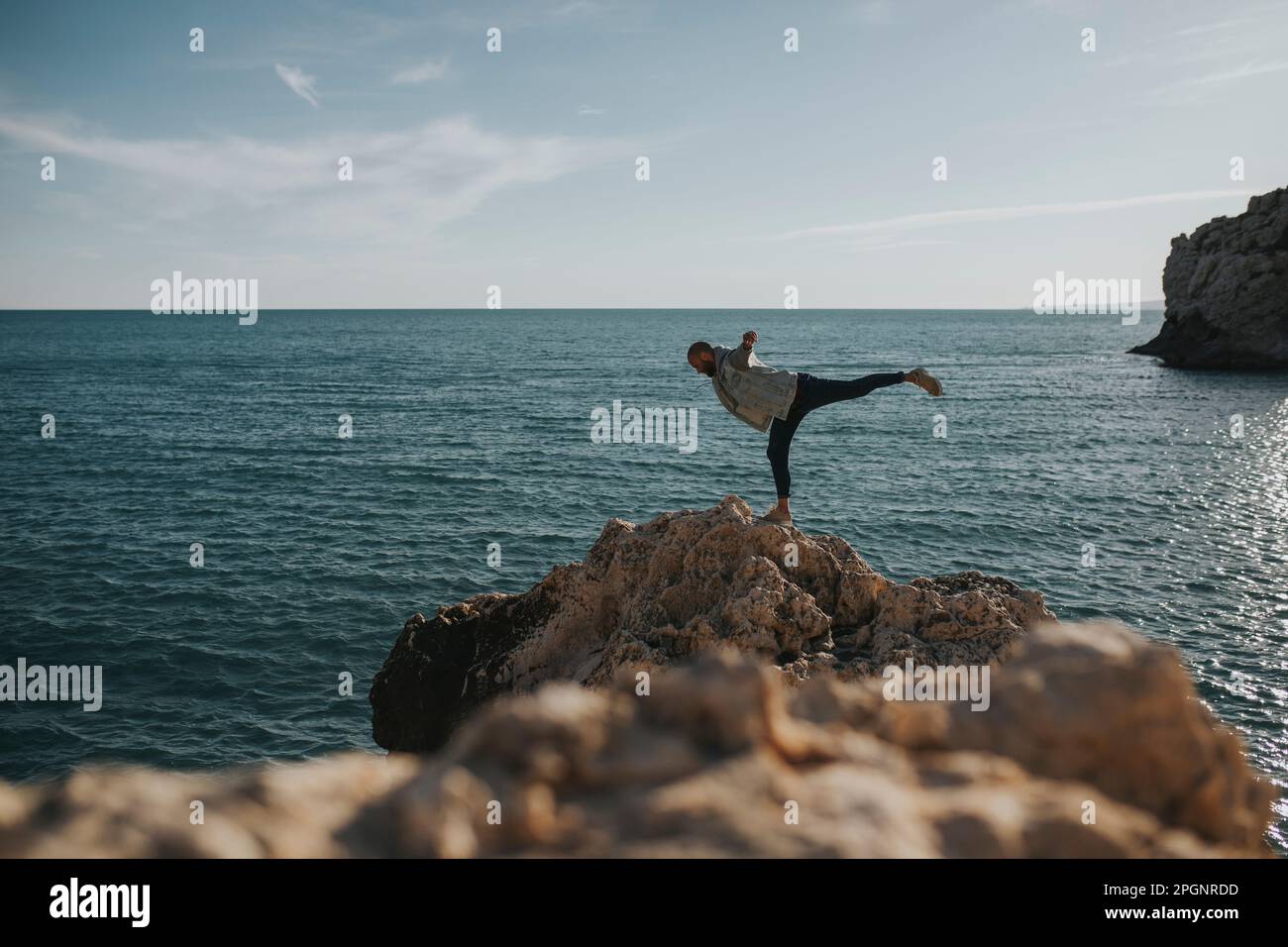 One rock in sea hi-res stock photography and images - Alamy