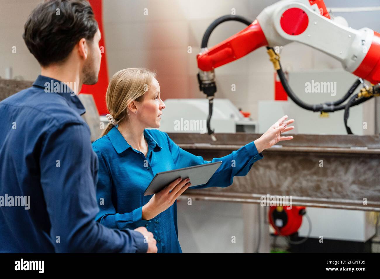 Engineer explaining talking colleague hi-res stock photography and ...