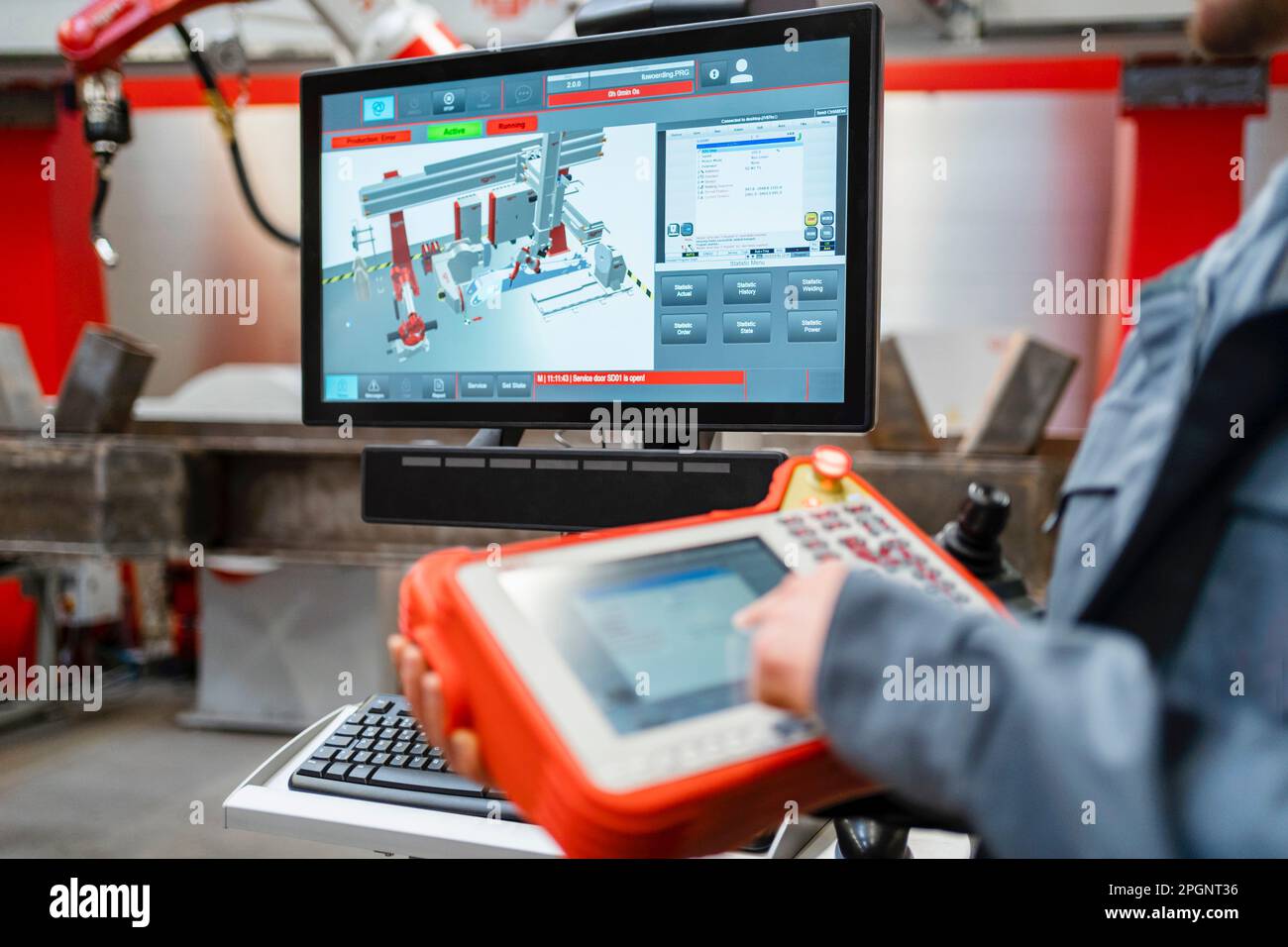 Monitor screen with engineer operating controller in industry Stock ...