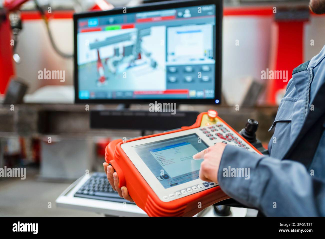 Engineer touching screen of controller in industry Stock Photo - Alamy