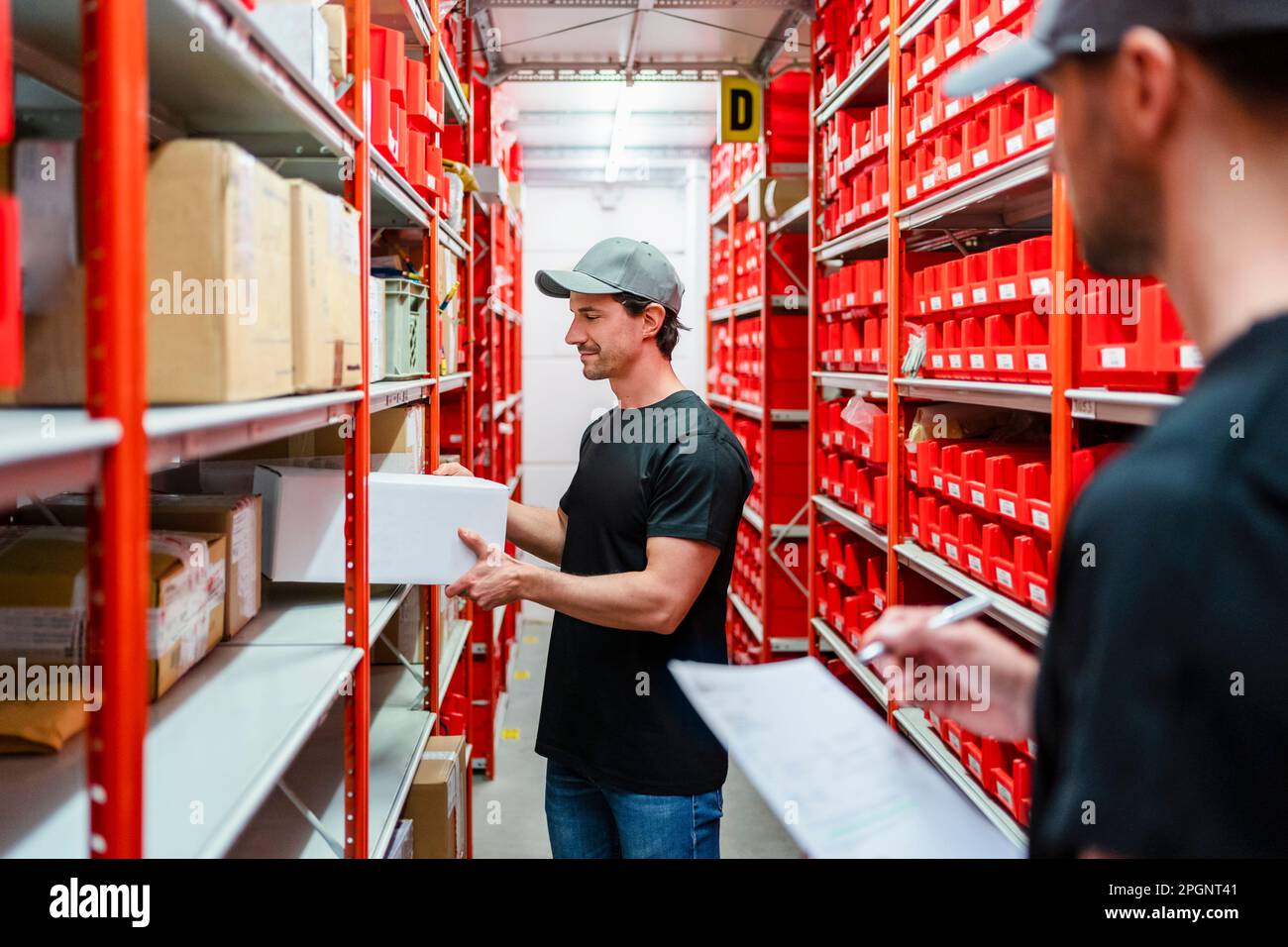 Warehouse workers taking inventory in factory Stock Photo - Alamy