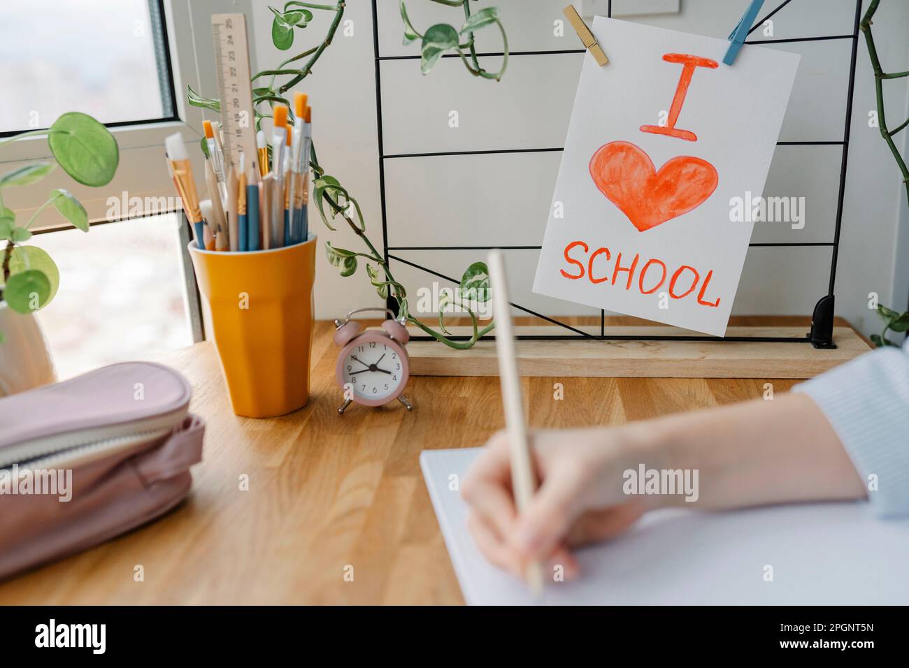 Text written on card with girl doing homework in foreground Stock Photo ...