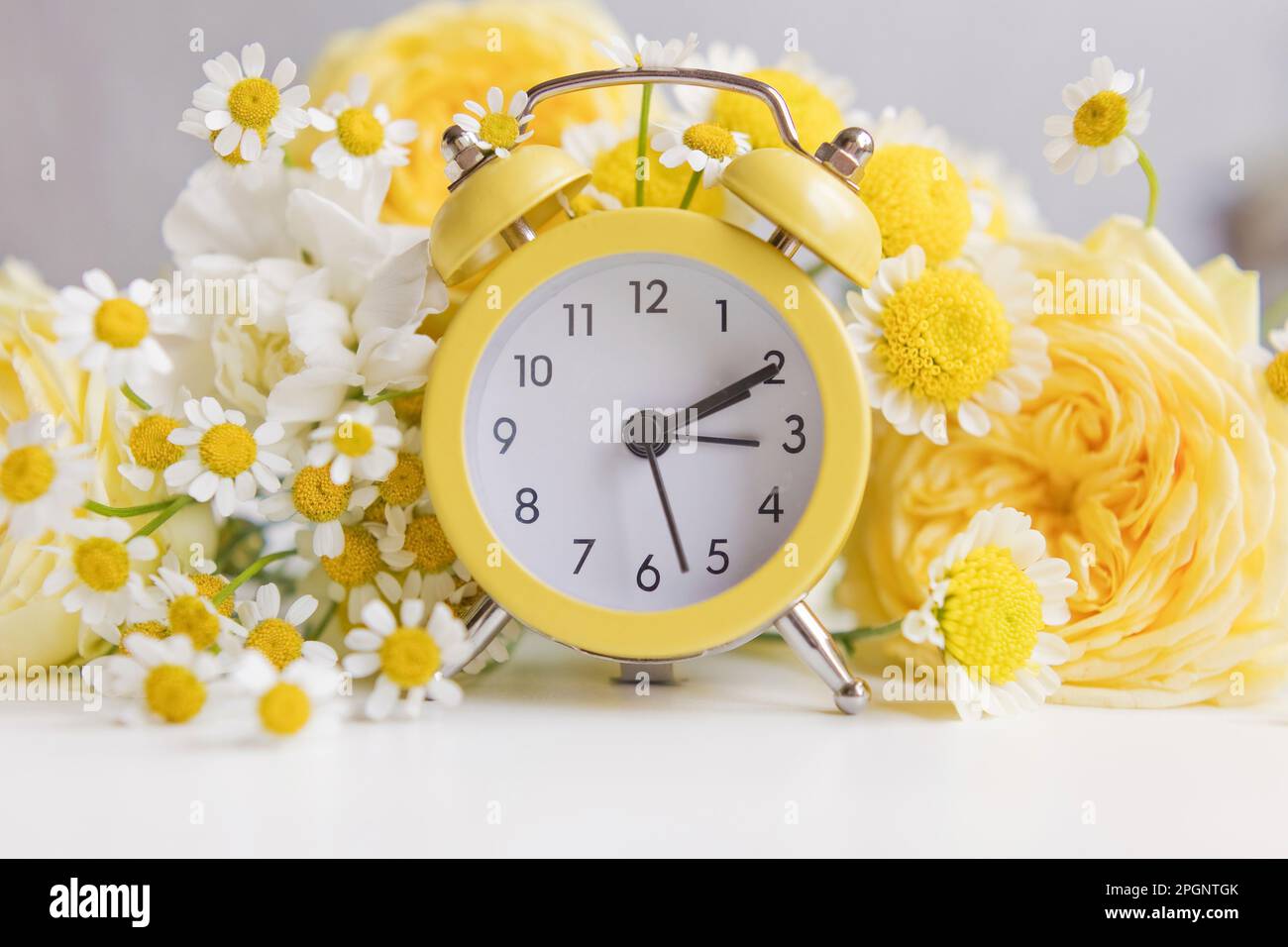 Clock and flowers hi-res stock photography and images - Alamy