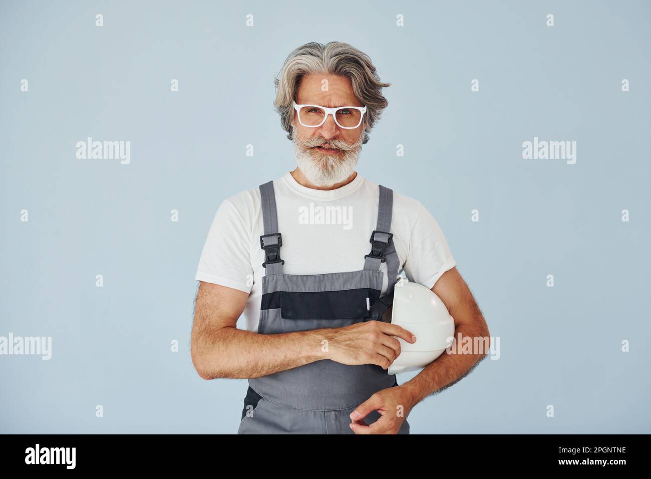 Repairman ready for work. Senior stylish modern man with grey hair and ...