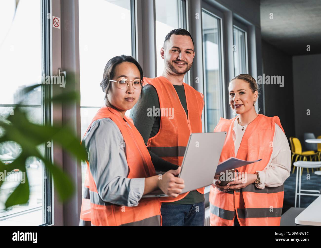 Smiling multiracial technicians standing together at office Stock Photo ...