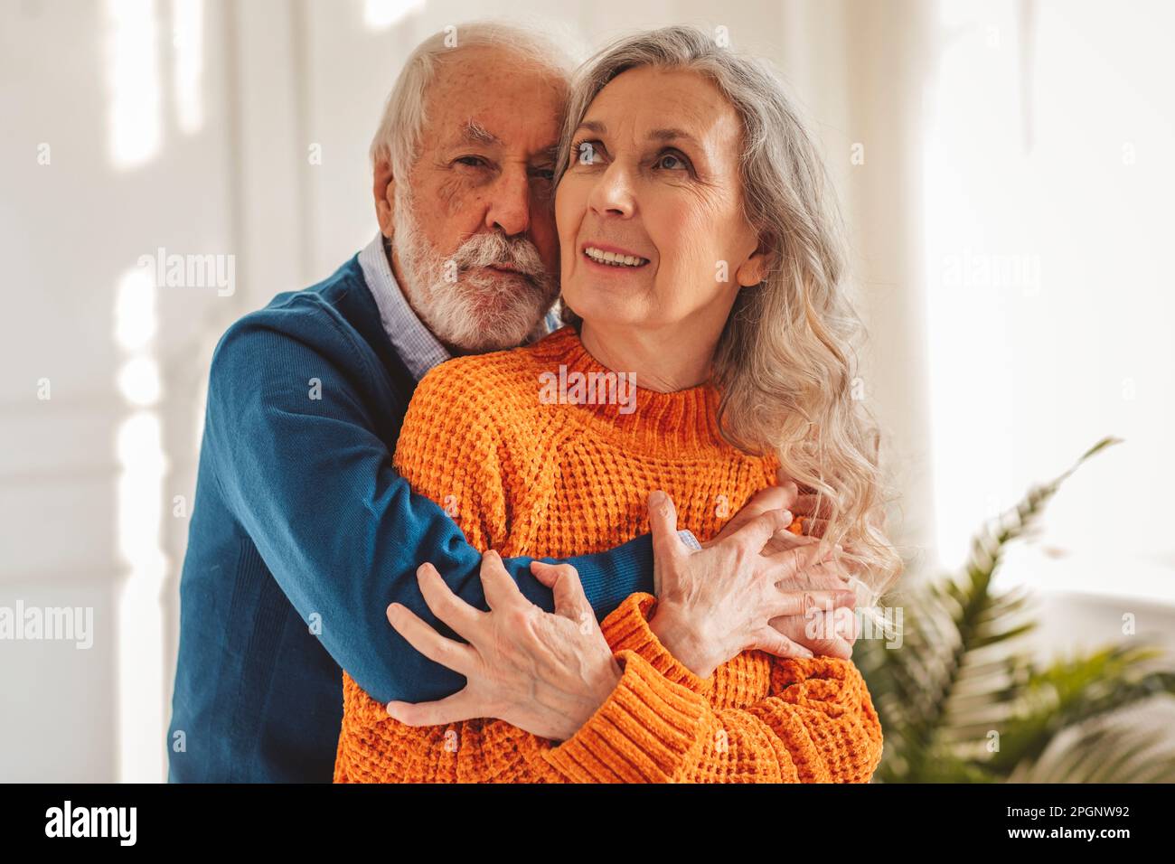 Man hugging woman from behind Stock Photo - Alamy