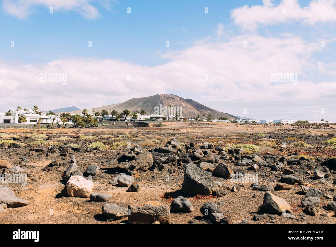 Spain, Canary Islands, Lanzarote, Rocky landscape with Montana Roja ...