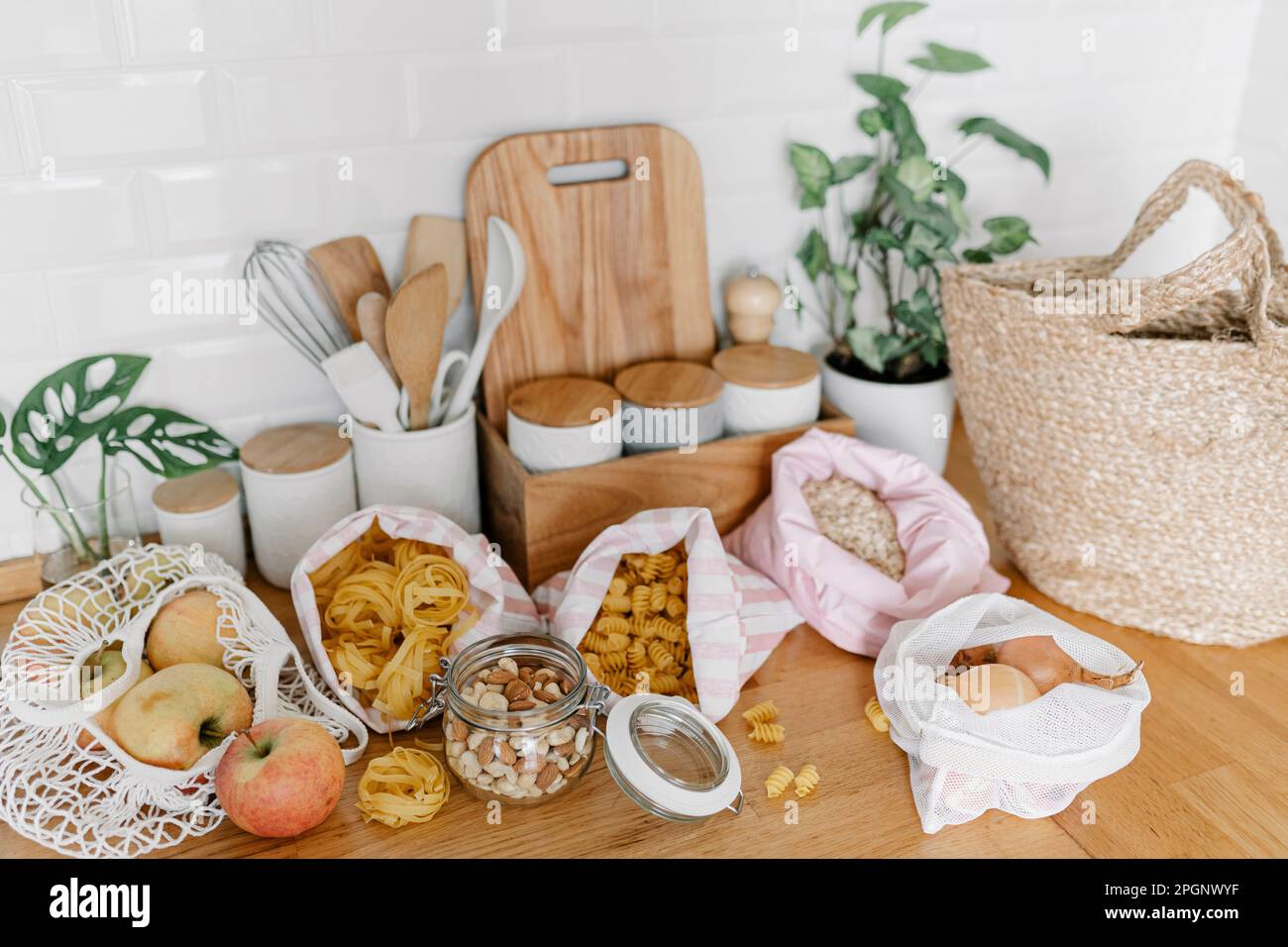 Bags with raw ingredients lying on kitchen counter Stock Photo - Alamy
