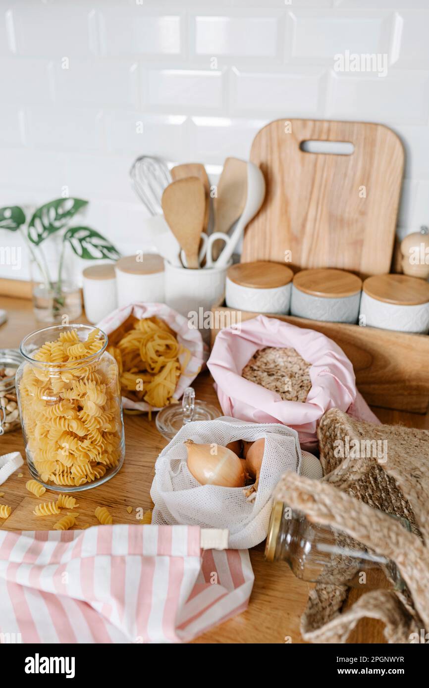 Bags with raw ingredients lying on kitchen counter Stock Photo - Alamy