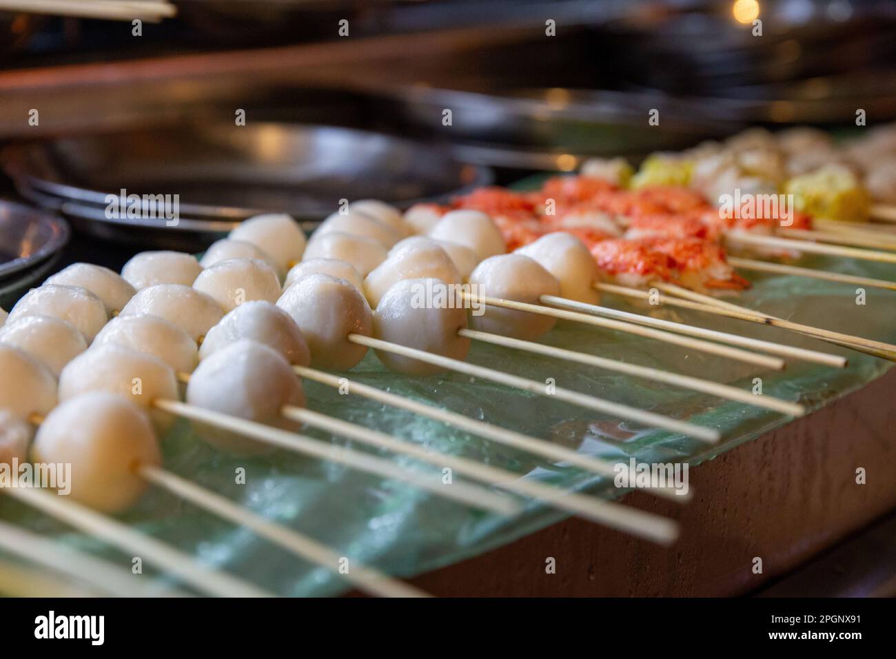 Various Seafood balls on a stick for snacking Stock Photo - Alamy