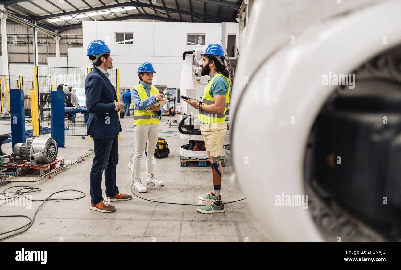 Female male engineers having discussion hi-res stock photography and ...