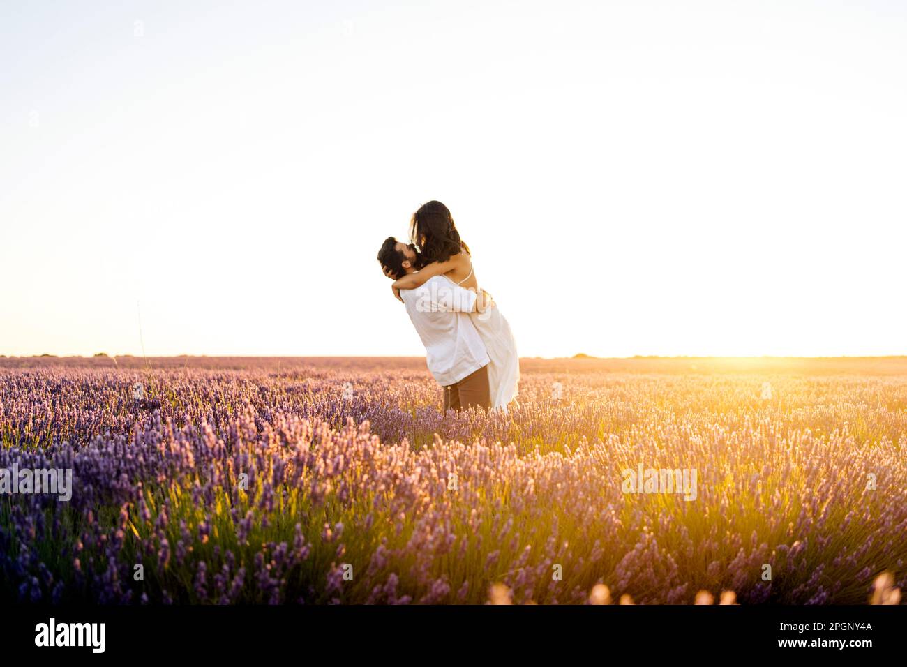 Romantic man carrying woman in hi-res stock photography and images - Alamy