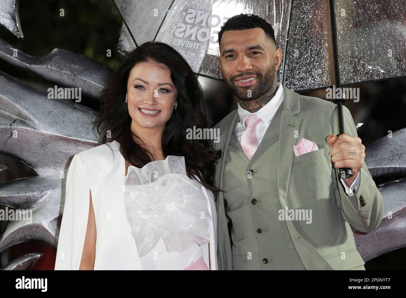 Jess Impiazzi, left, and Jermaine Pennant pose for photographers upon ...