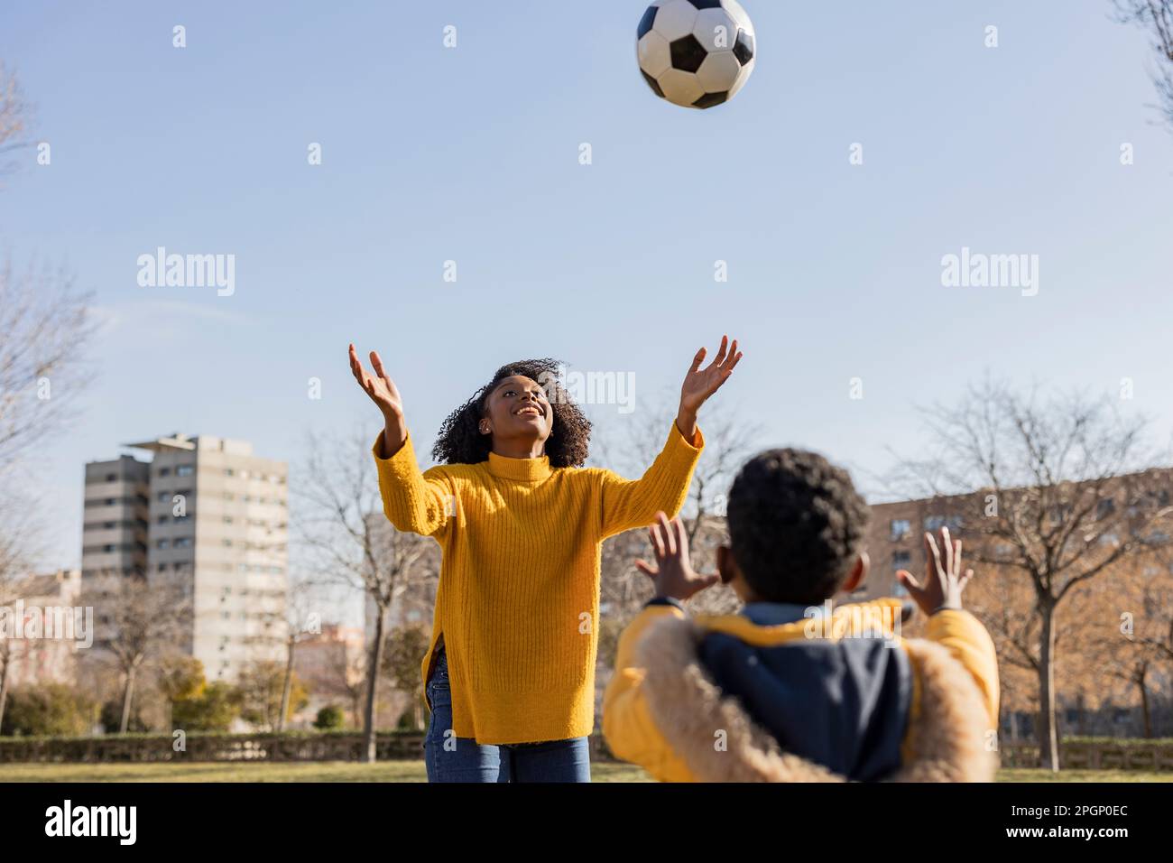Child catching ball hi-res stock photography and images - Alamy