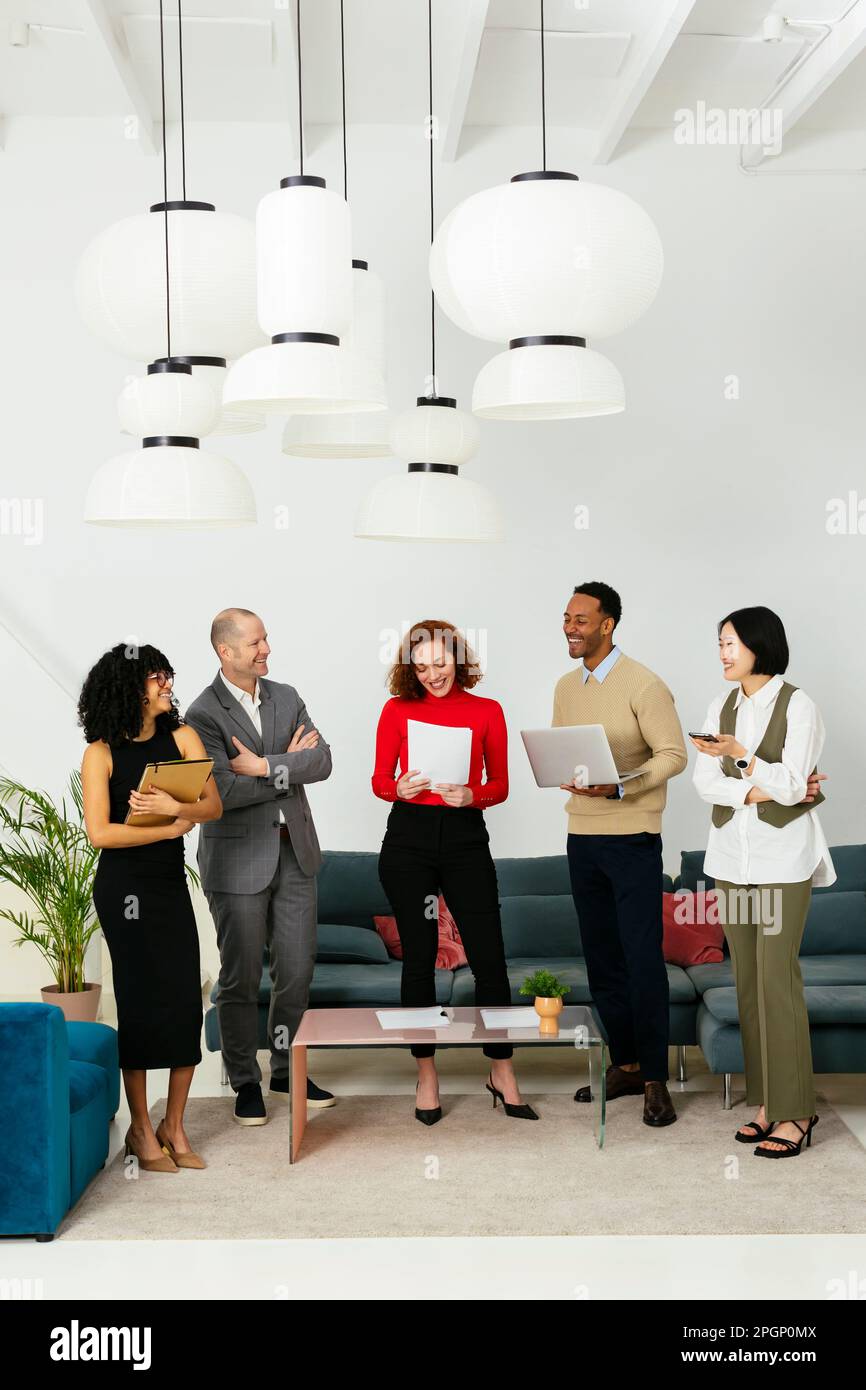 Happy multiracial business people standing together in office Stock ...