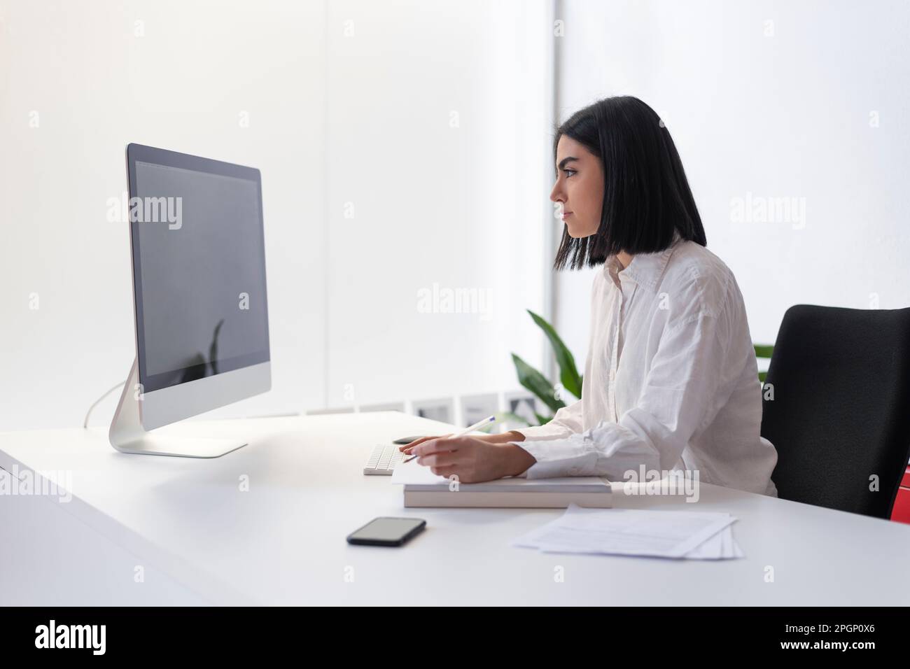Businesswoman working on desktop pc hi-res stock photography and images ...