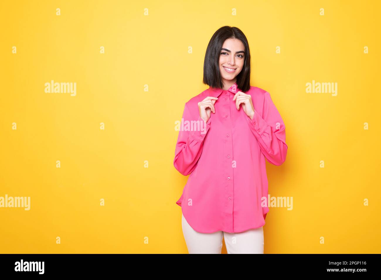 Woman wearing pink shirt hi-res stock photography and images - Alamy