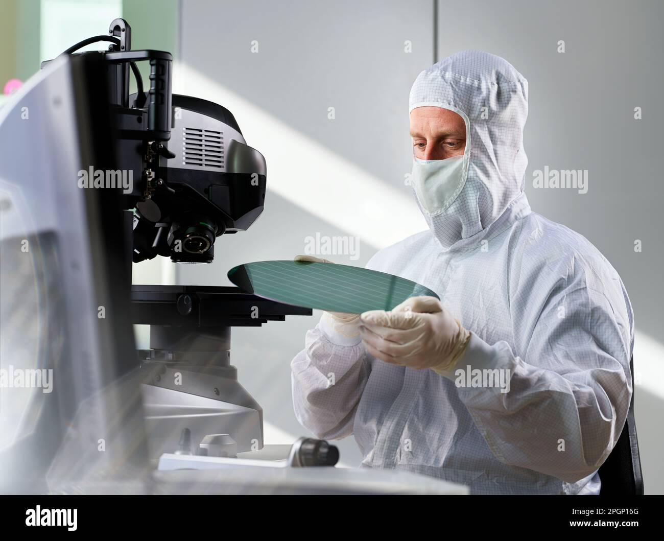 Engineer putting wafer chip on microscope in laboratory Stock Photo - Alamy
