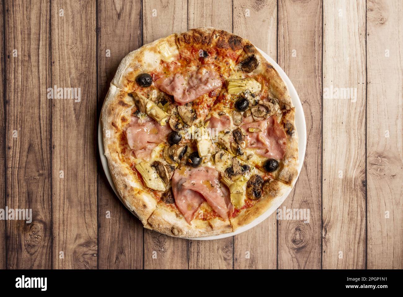 Pizza capricciosa is a style of pizza from Italian cuisine prepared ...