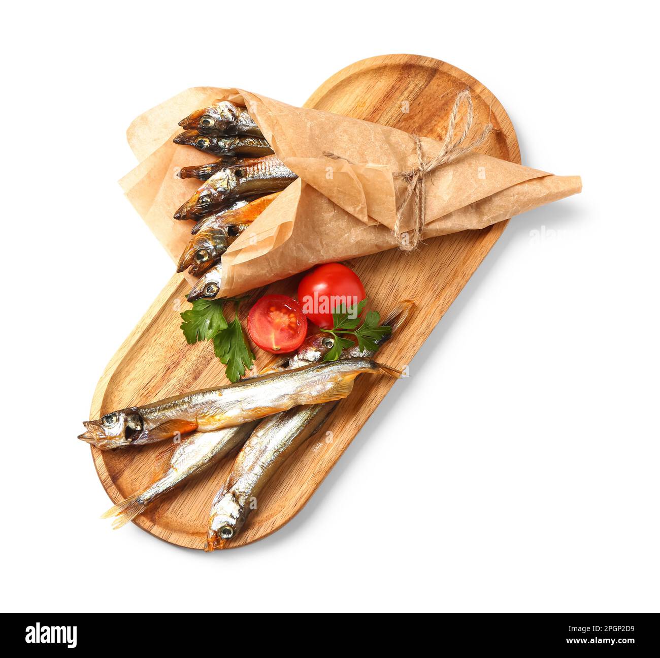 Board with delicious smoked capelin wrapped in parchment isolated on ...