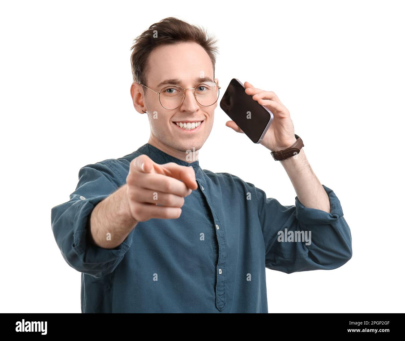 Cool young man talking by phone on white background Stock Photo - Alamy