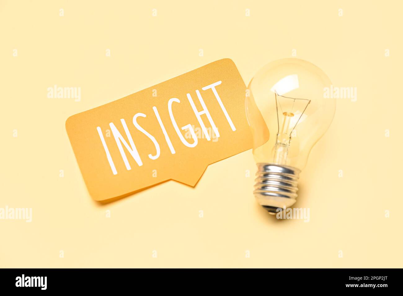 Speech bubble with word INSIGHT and light bulb on beige background ...