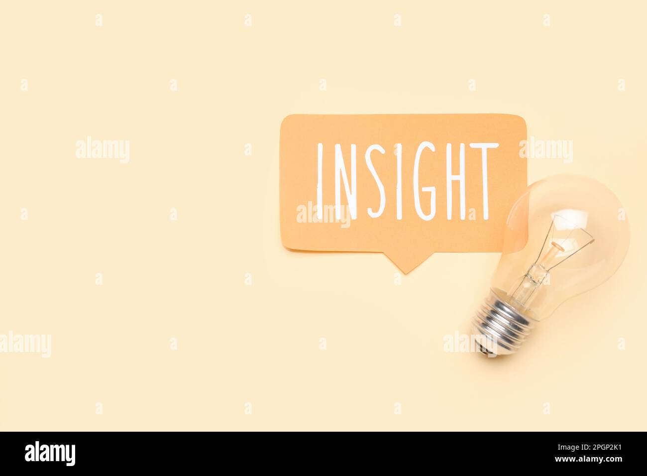 Speech bubble with word INSIGHT and light bulb on beige background ...
