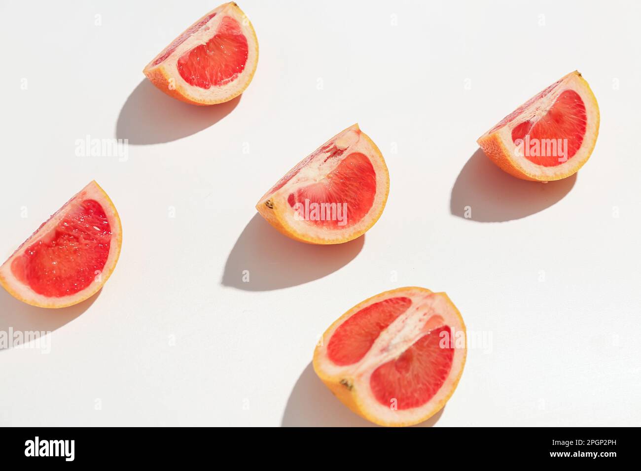 Pieces of ripe grapefruit isolated on white background Stock Photo - Alamy