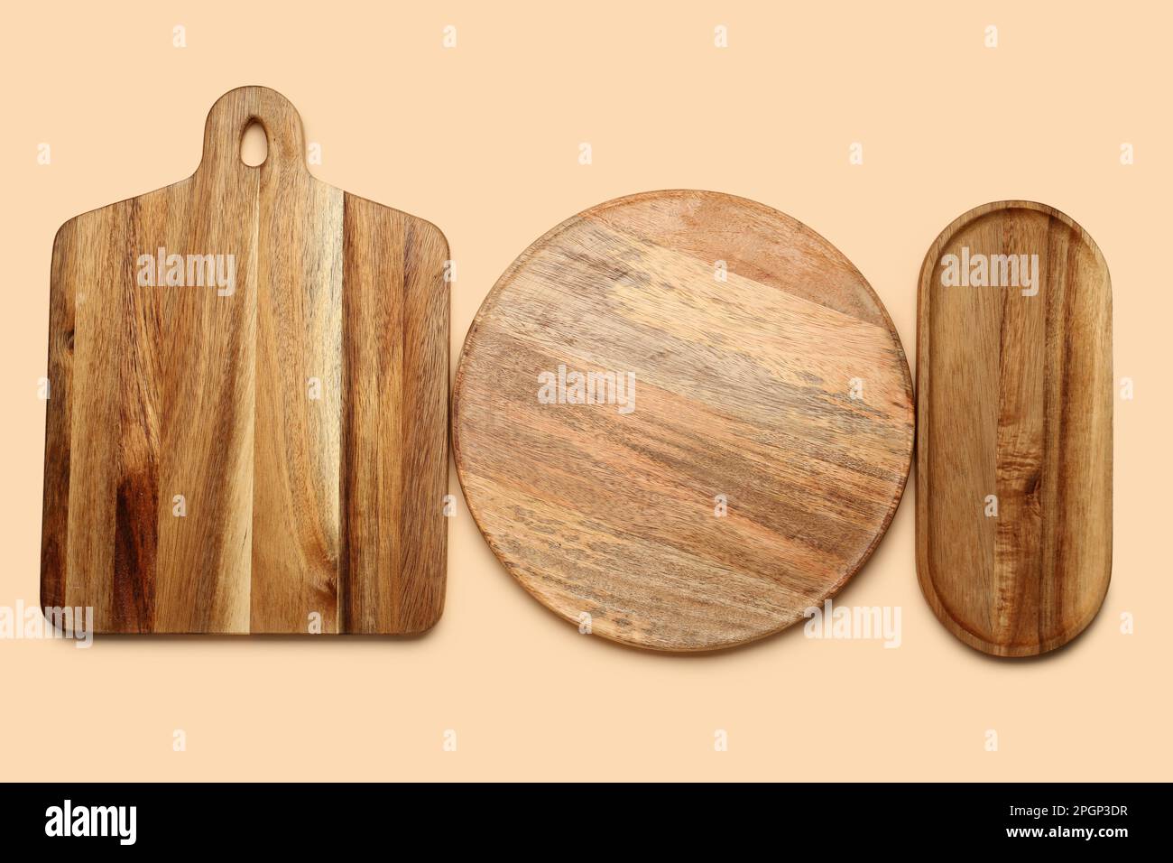 Different wooden boards on color background Stock Photo - Alamy