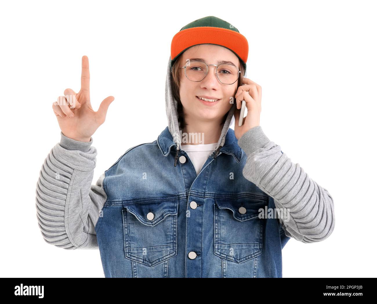 Cool teenage boy talking by mobile phone on white background Stock ...