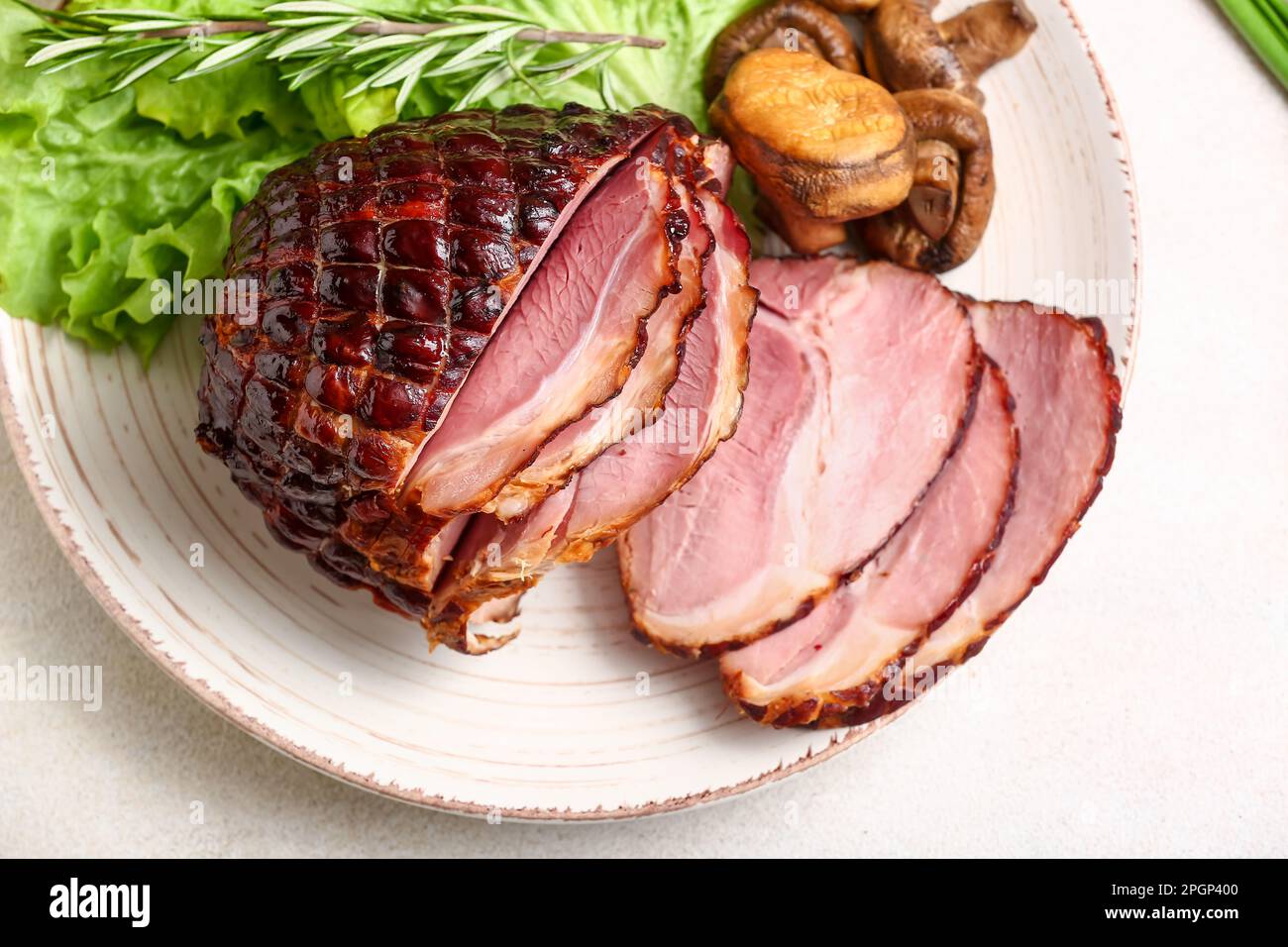 Plate with tasty smoked ham and grilled mushrooms on white background ...