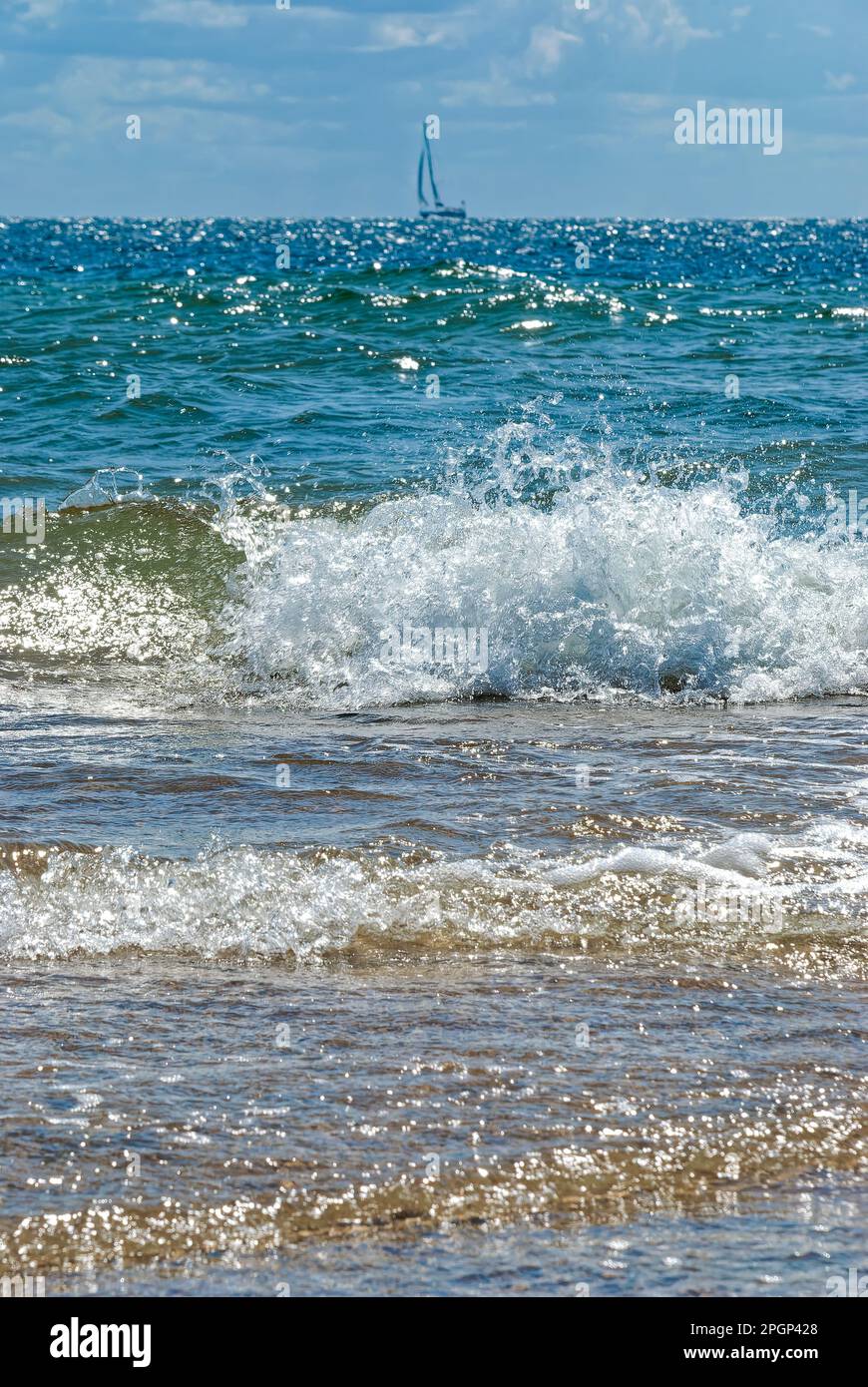 wallpaper with waves - splashing waves in the sun, sailboat on the ...