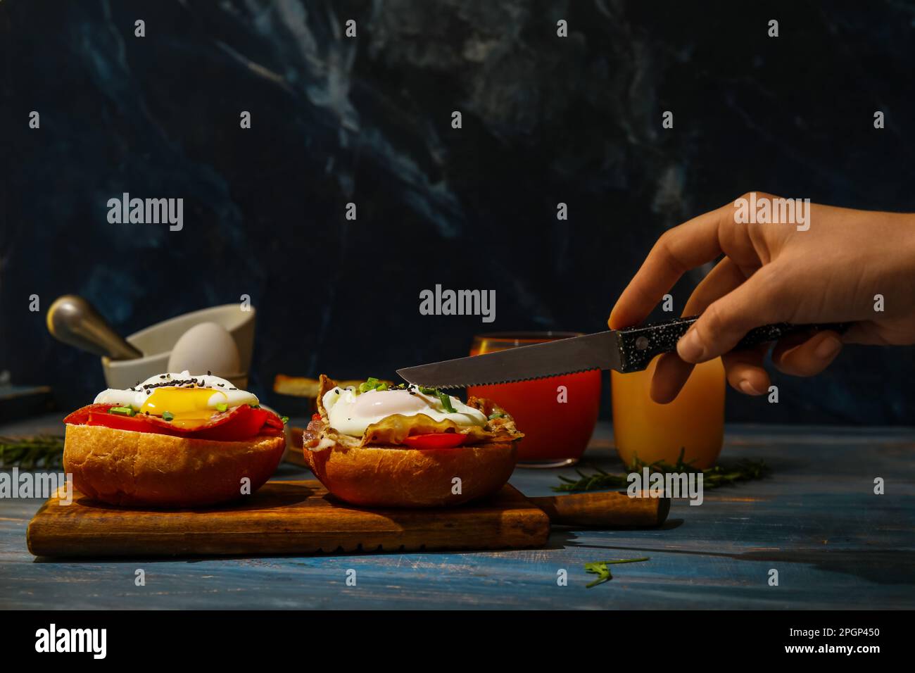 Person cutting tasty eggs hi-res stock photography and images - Alamy